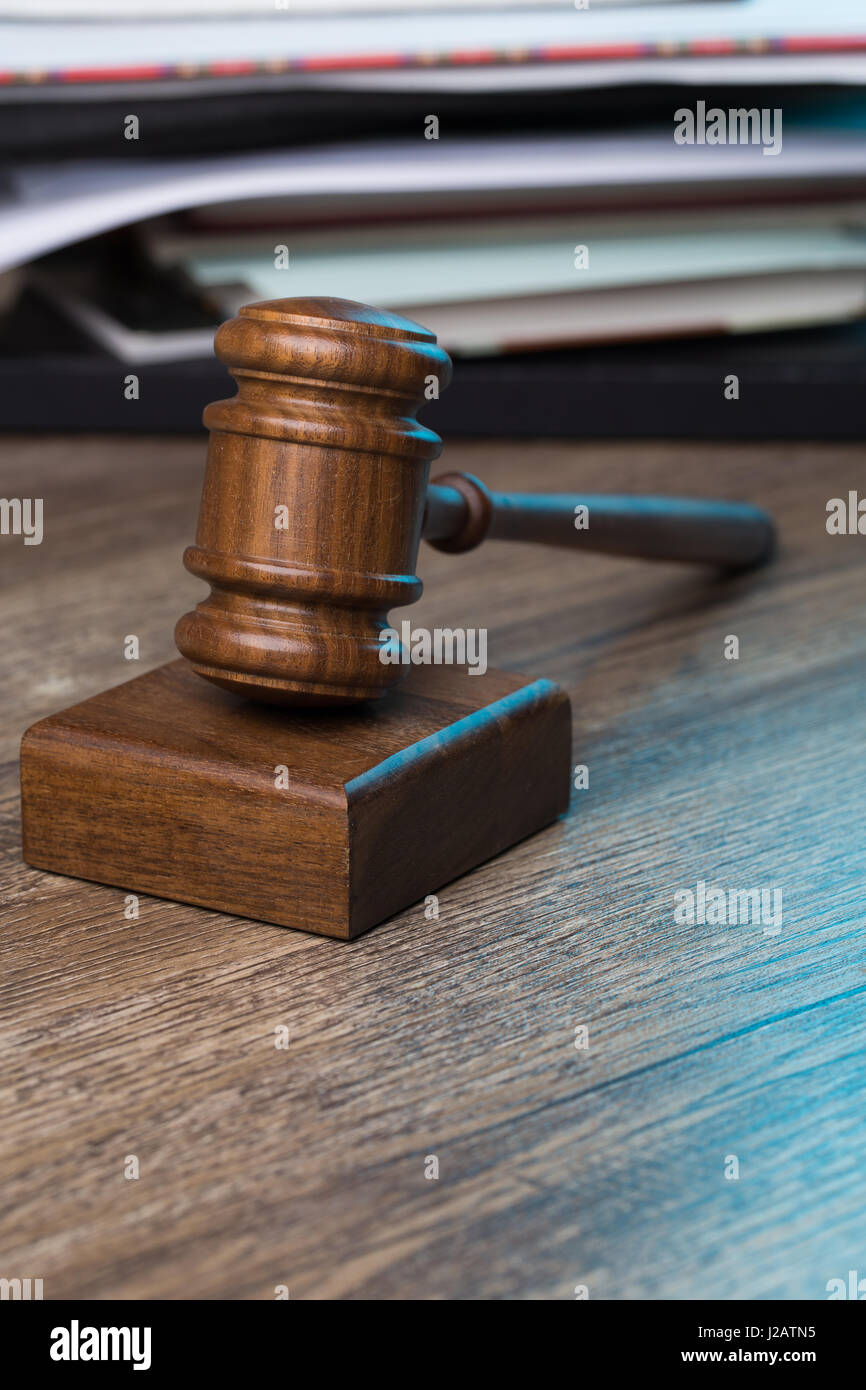 Hammer of judge background papers Stock Photo - Alamy