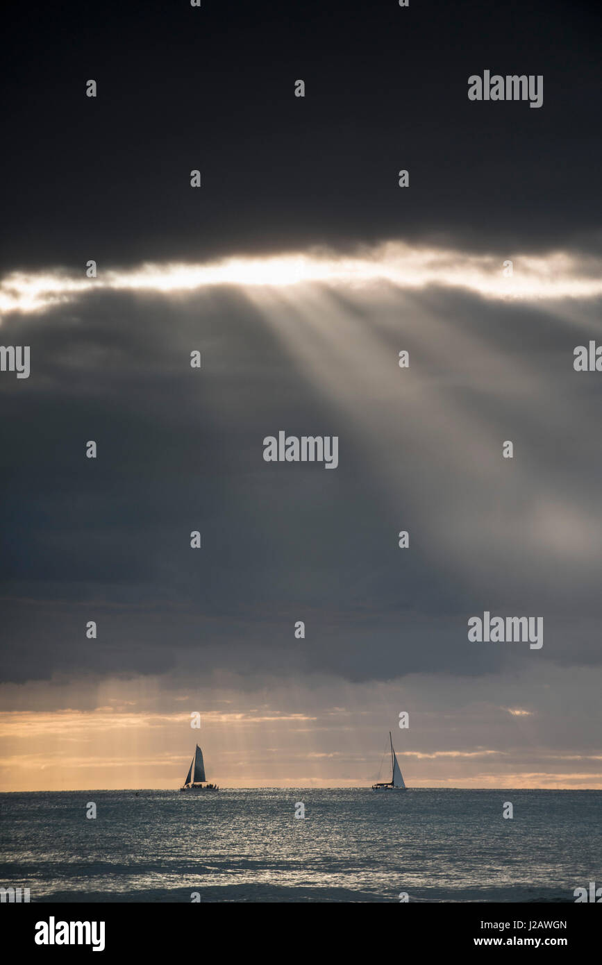 Distant view of yachts in sea against dramatic sky Stock Photo - Alamy