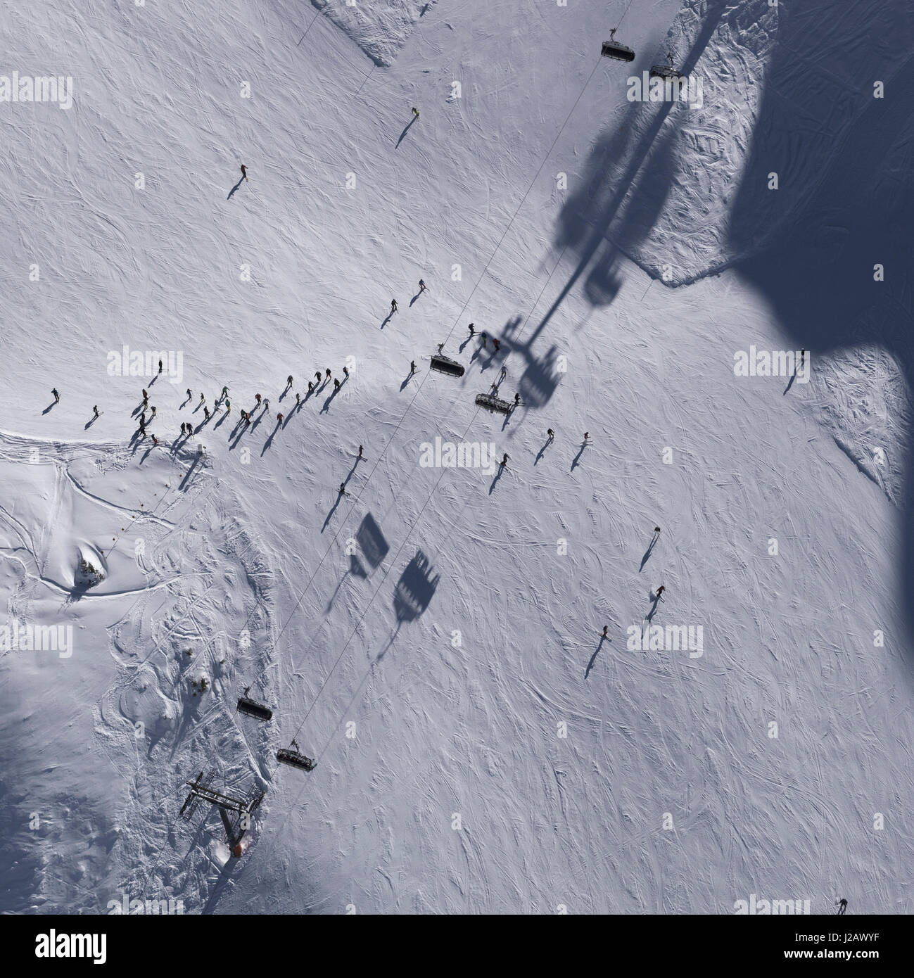 Aerial view of skiers on snow covered field Stock Photo - Alamy