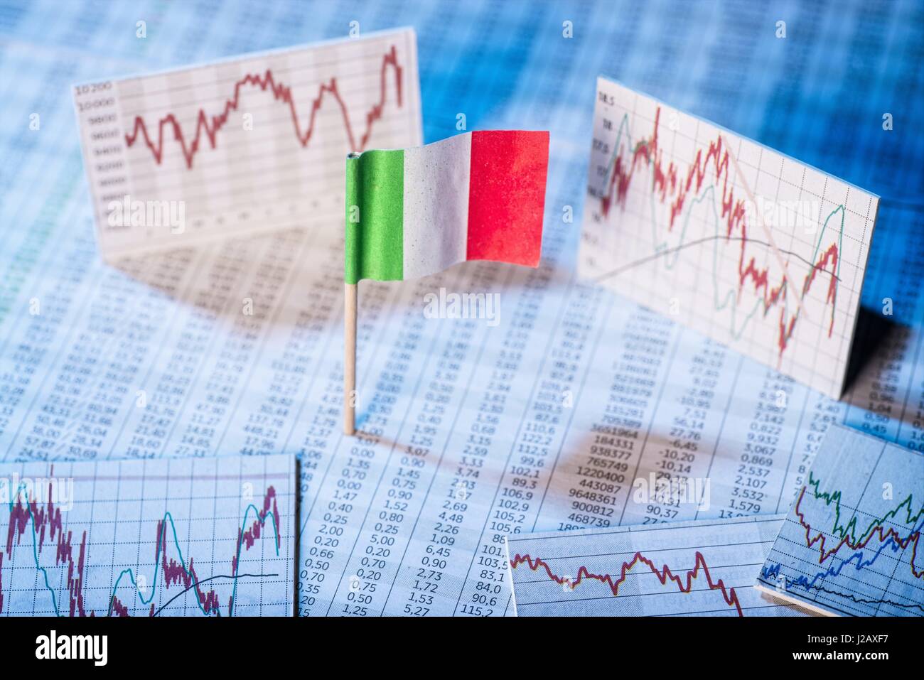 Italian flag with rate tables and graphs for economic development ...