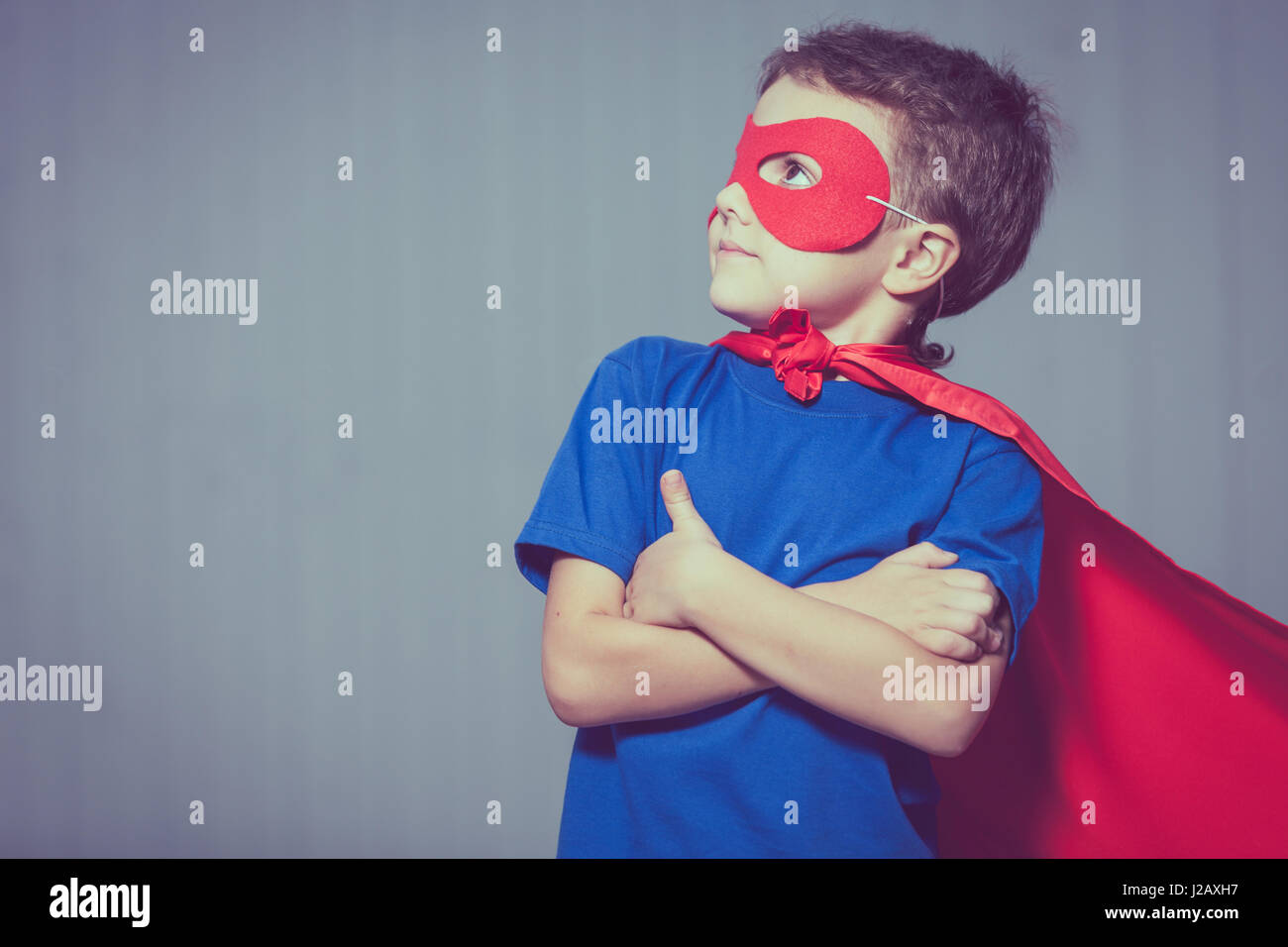 Happy little child playing superhero. Kid having fun outdoors. Concept ...