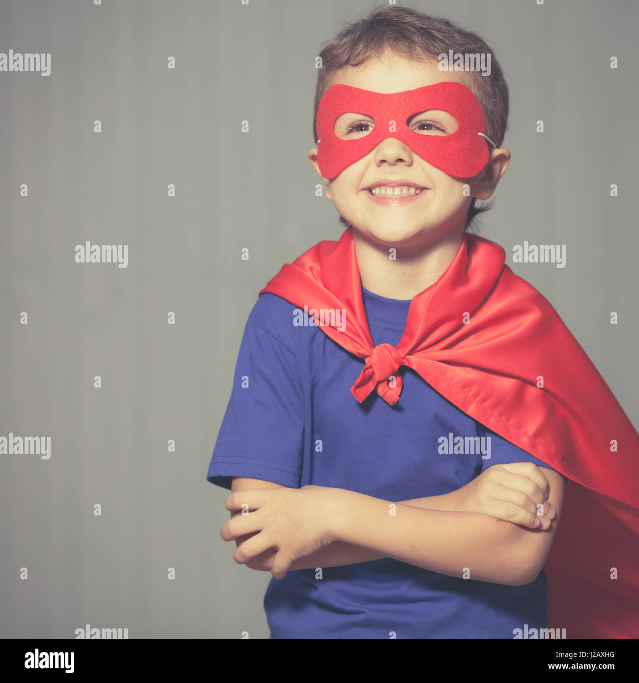 Happy little child playing superhero. Kid having fun outdoors. Concept ...