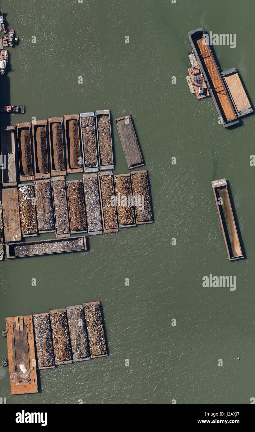 Aerial view of rocks and ores on barges in sea Stock Photo - Alamy