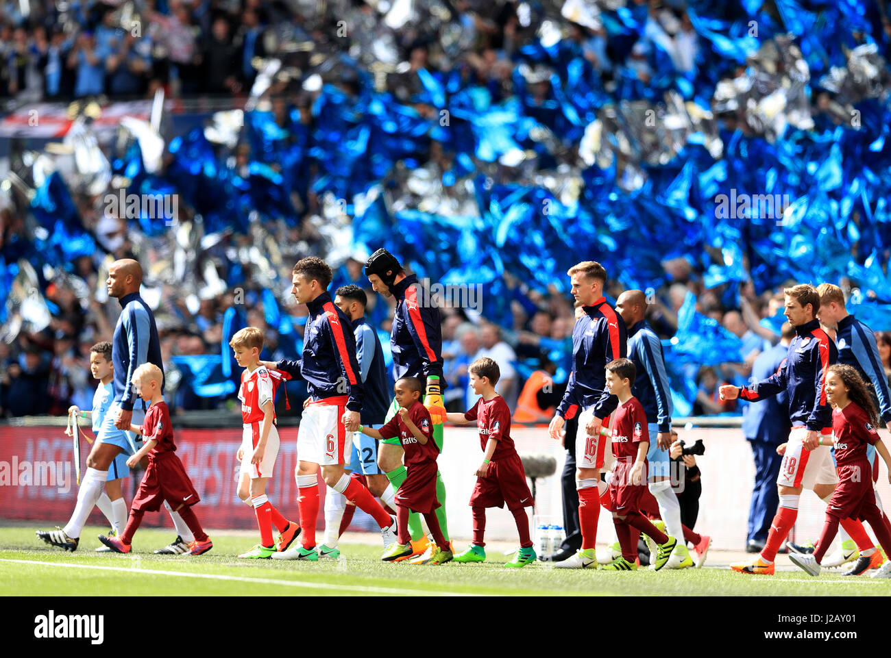 The two team's walk out before kick-off Stock Photo - Alamy