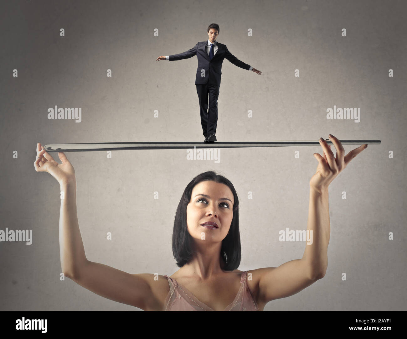 Man balancing on woman Stock Photo - Alamy
