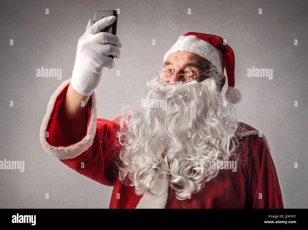 Santa Claus with phone Stock Photo - Alamy