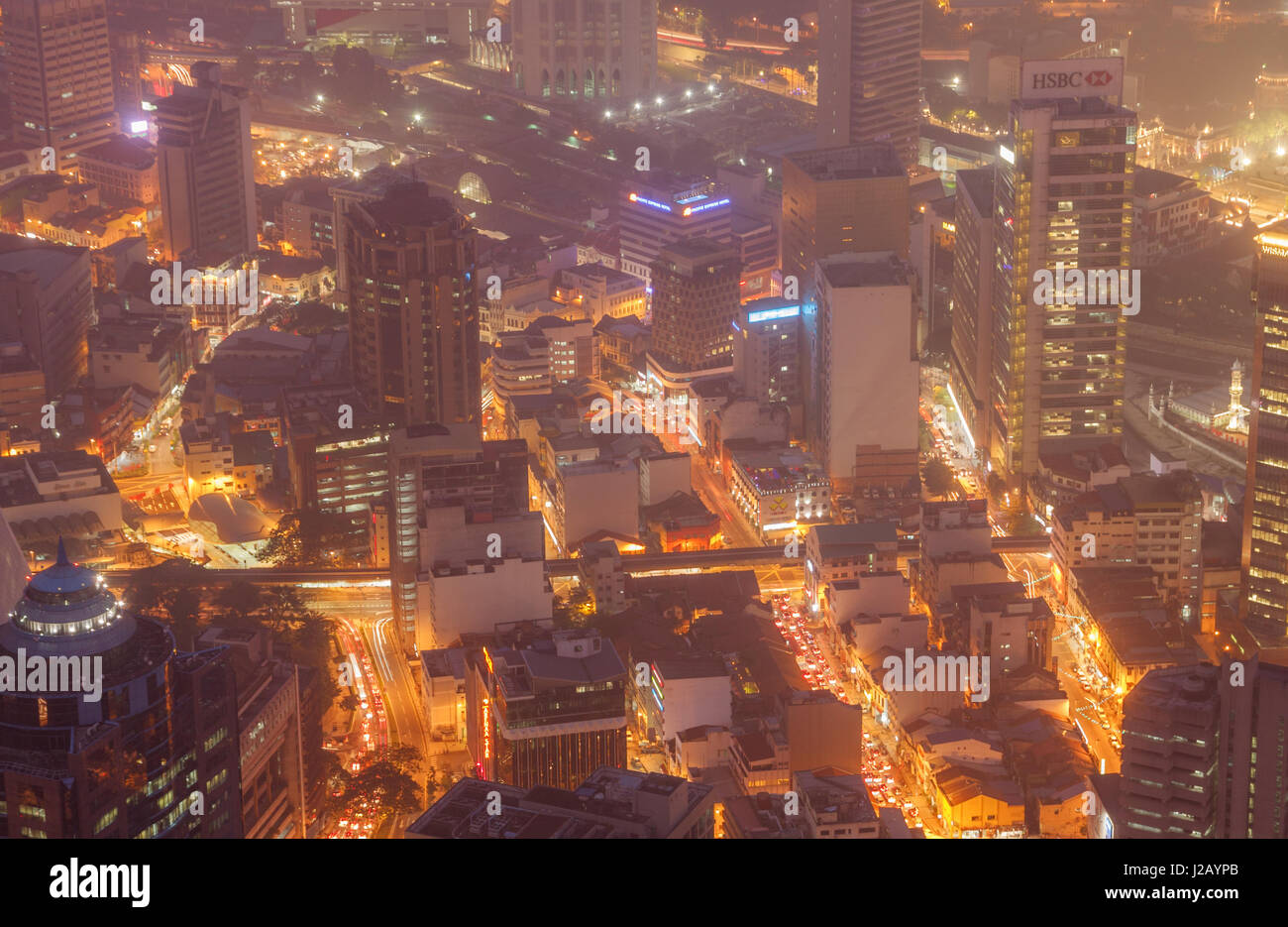 Hazy view of the Kuala Lumpur city center at night. The haze is caused ...