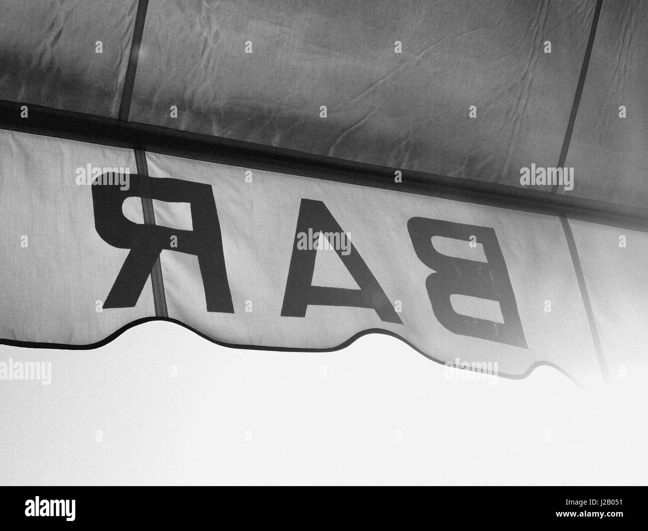 Low angle view of text on awning against sky Stock Photo - Alamy