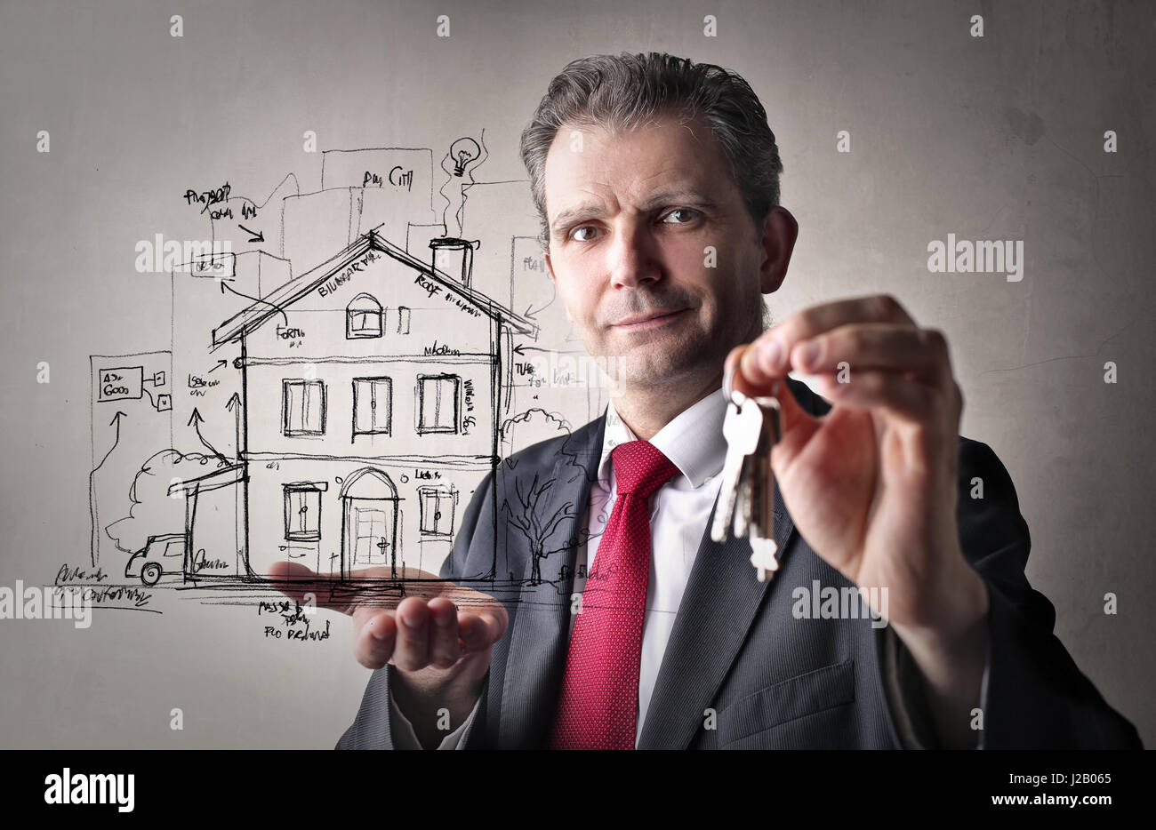 Businessman with keys and drawn house Stock Photo - Alamy
