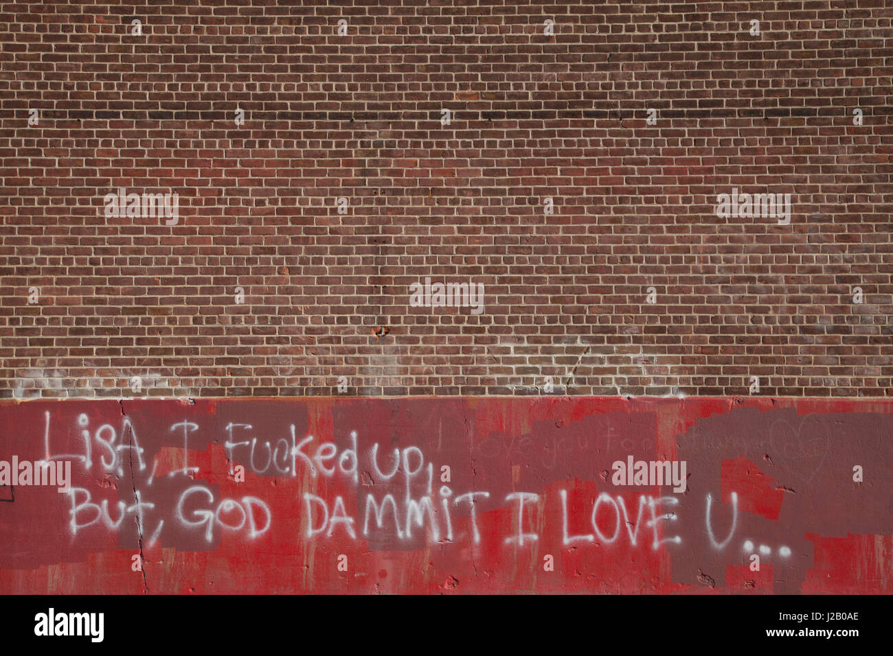 Spray paint message on wall Stock Photo - Alamy