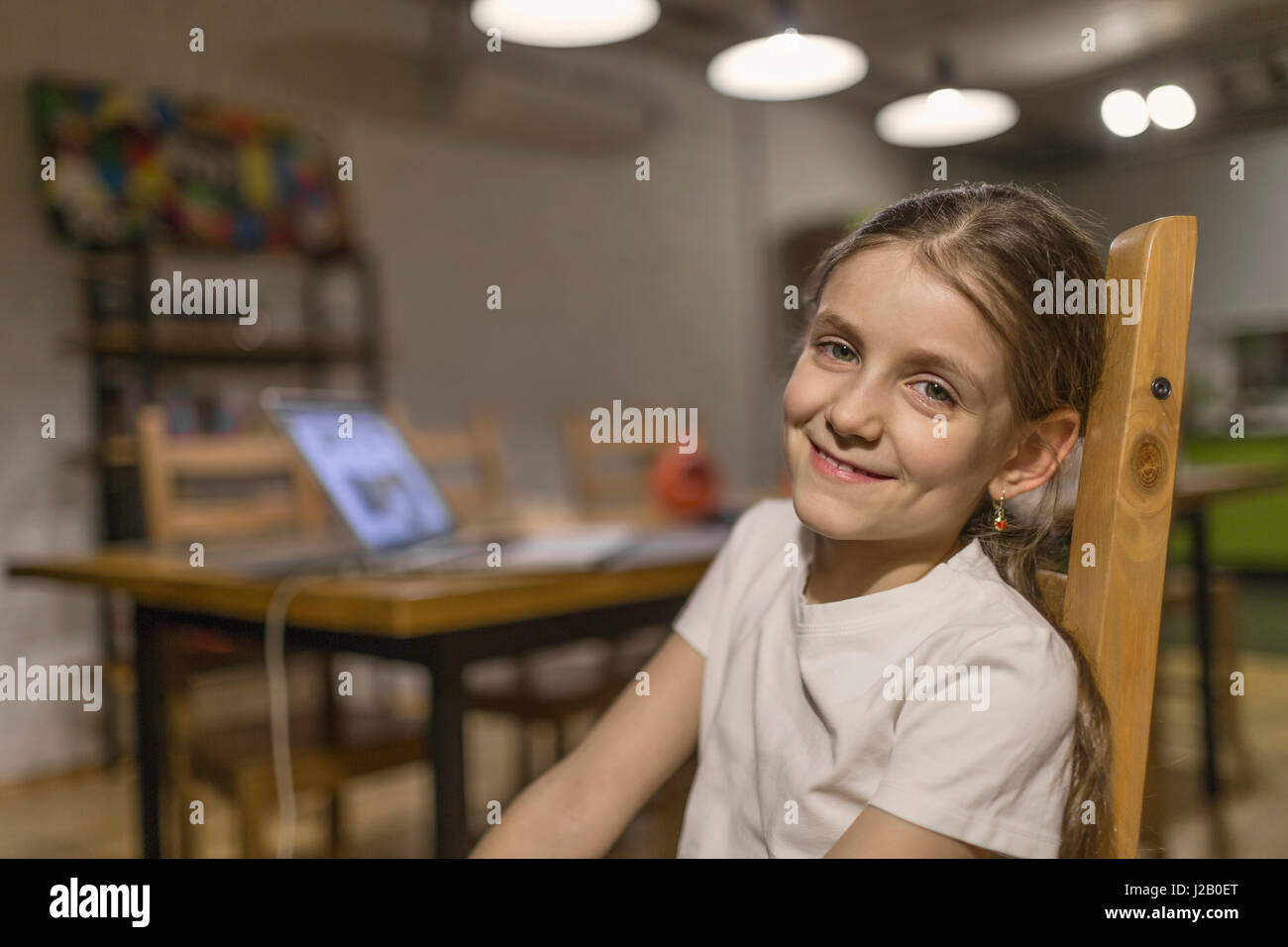 Portrait of girl sitting on chair hi-res stock photography and images ...