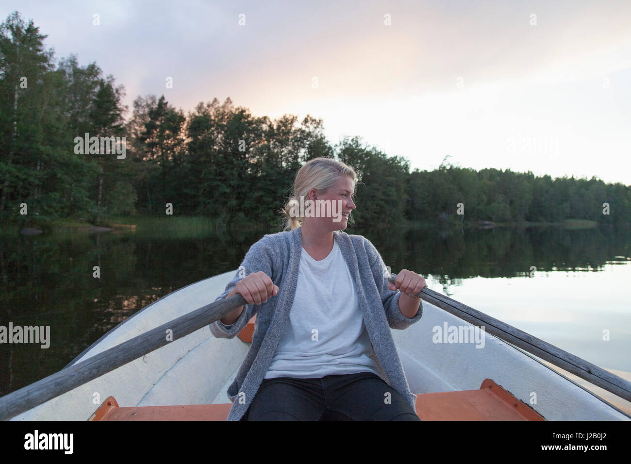 Woman on boat lake hi-res stock photography and images - Alamy