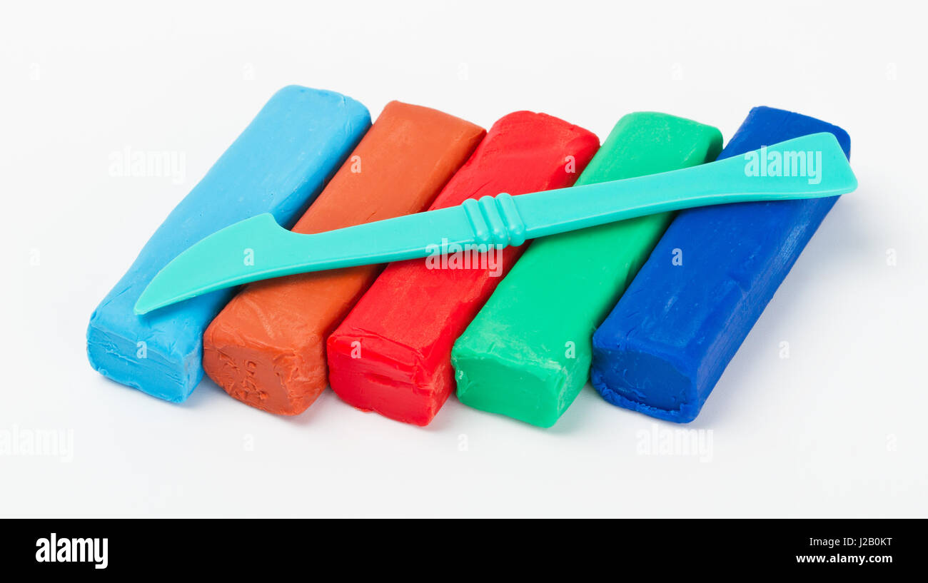 Colorful plasticine and tools on white background Stock Photo - Alamy
