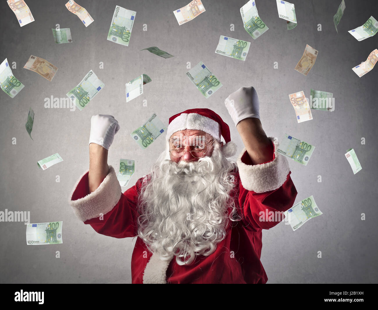 Money falling on Santa Claus Stock Photo - Alamy