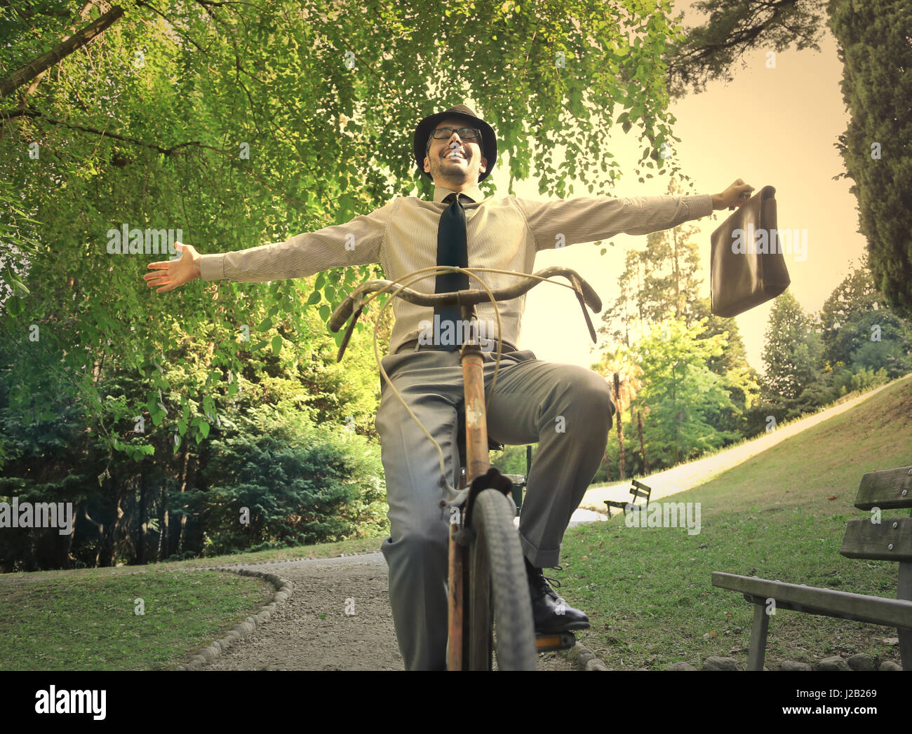 Man feeling free on bike Stock Photo - Alamy