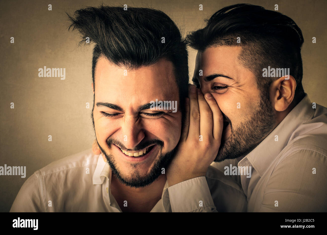 Whispering to each other hi-res stock photography and images - Alamy