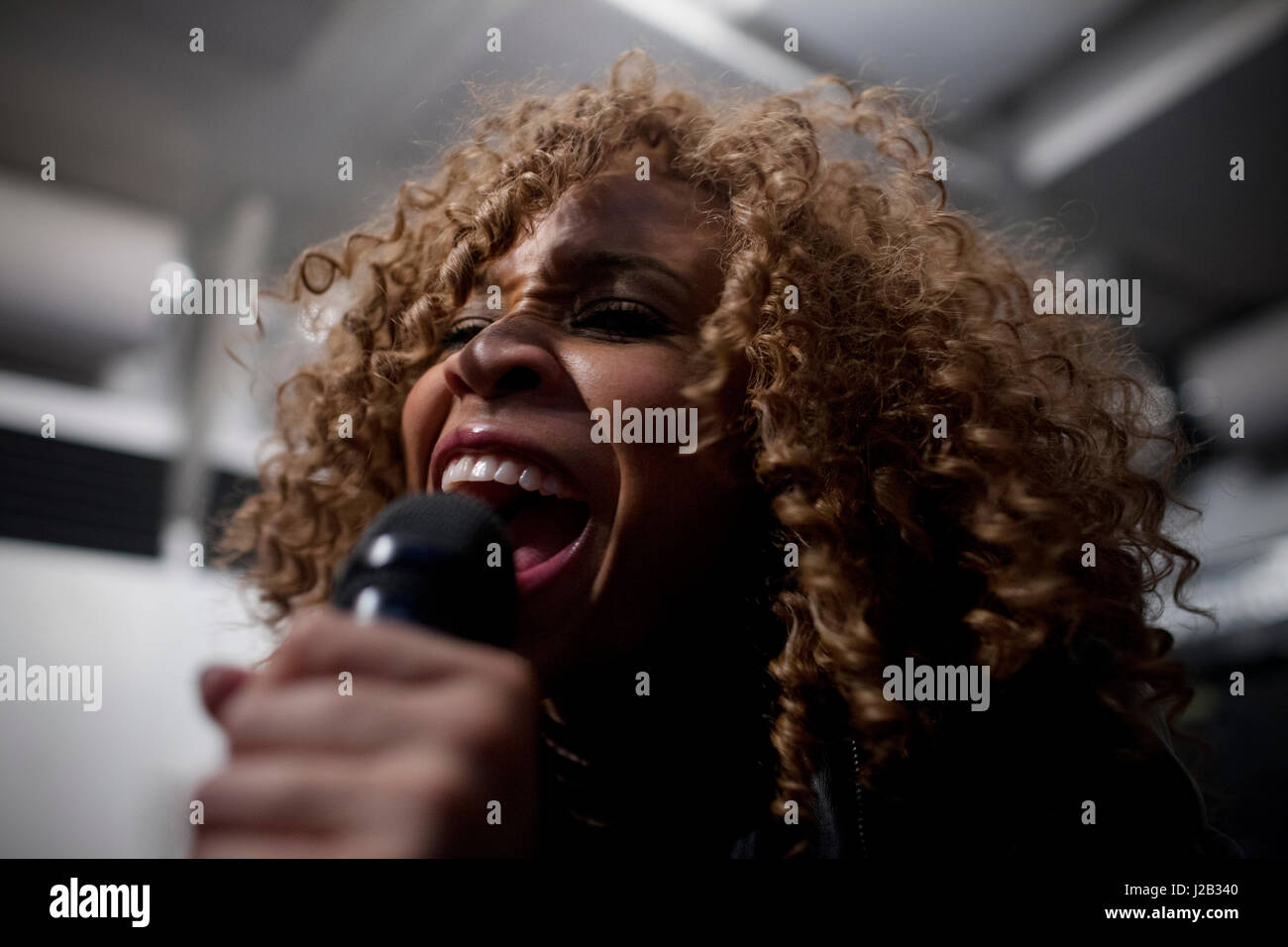 Singer performing in a recording studio Stock Photo - Alamy