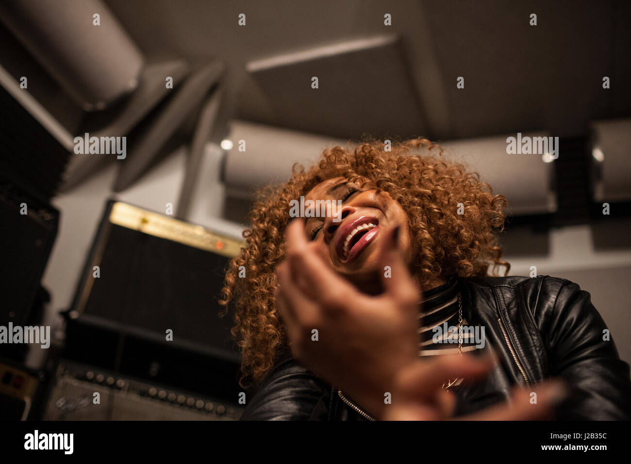 Singer performing in a recording studio Stock Photo - Alamy