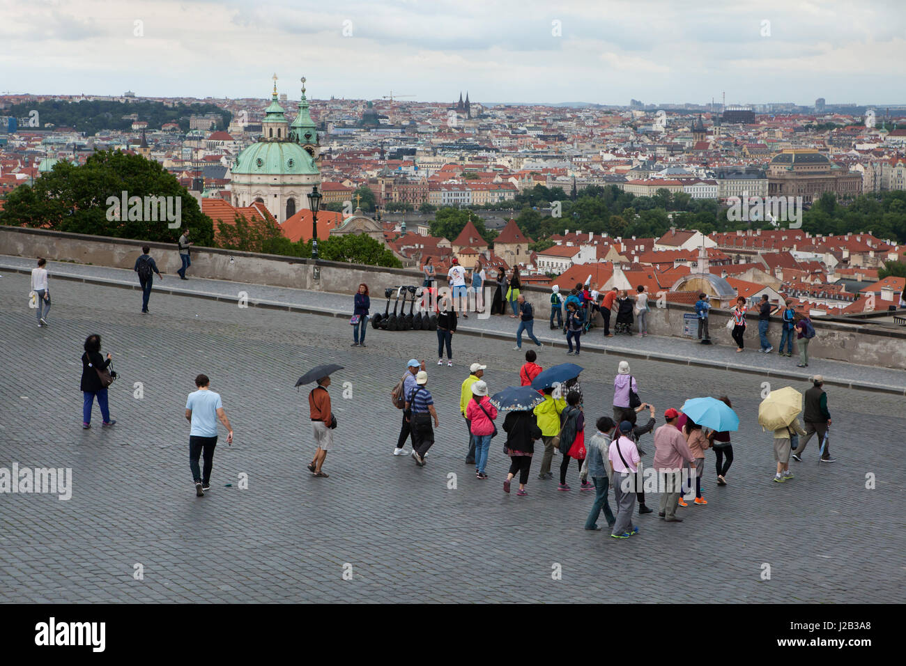 Tourists visit an observation point in Hradcany Square in Prague, Czech ...