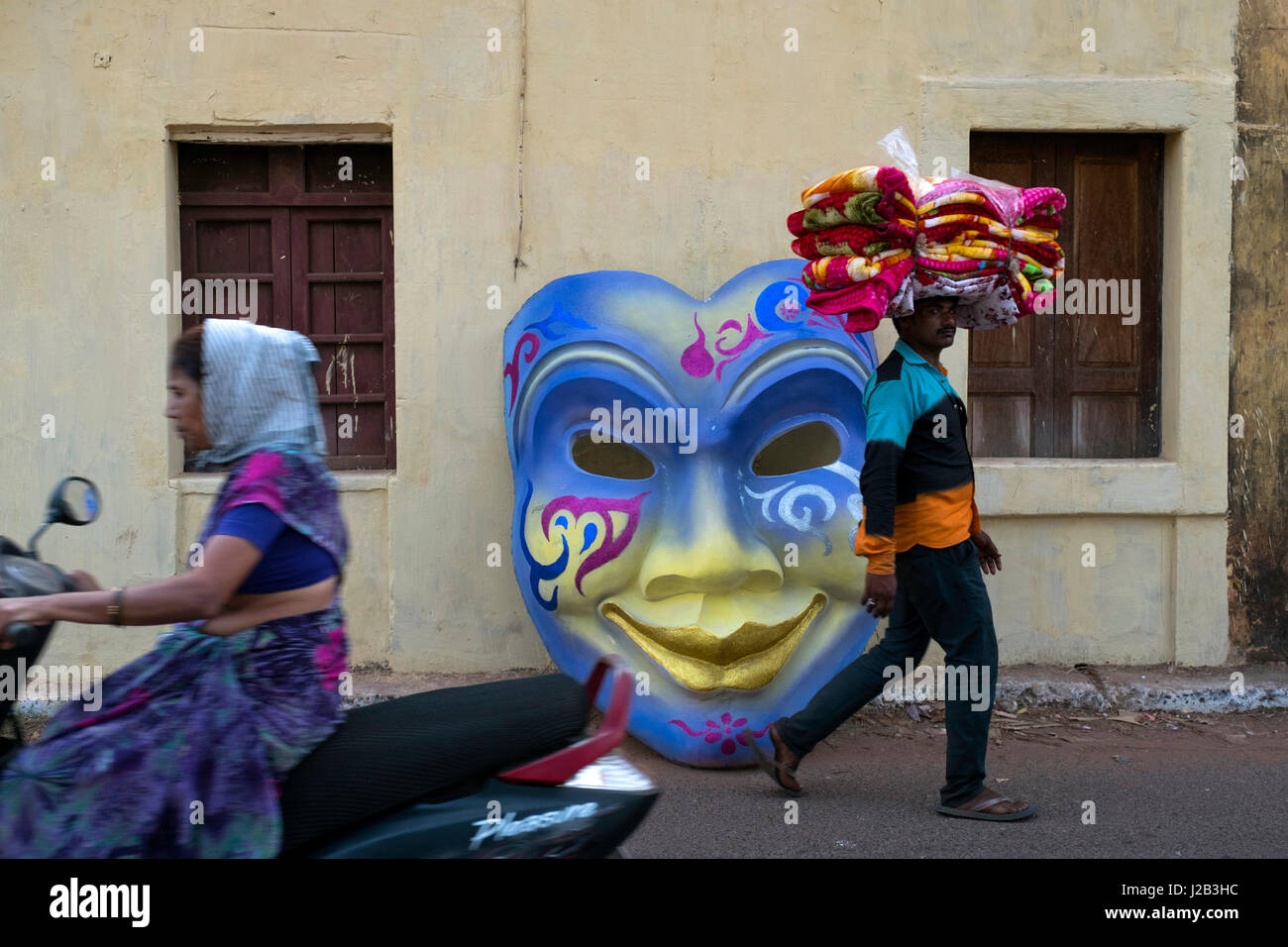 A huge mask has been left on the wall to dry the painting that ...