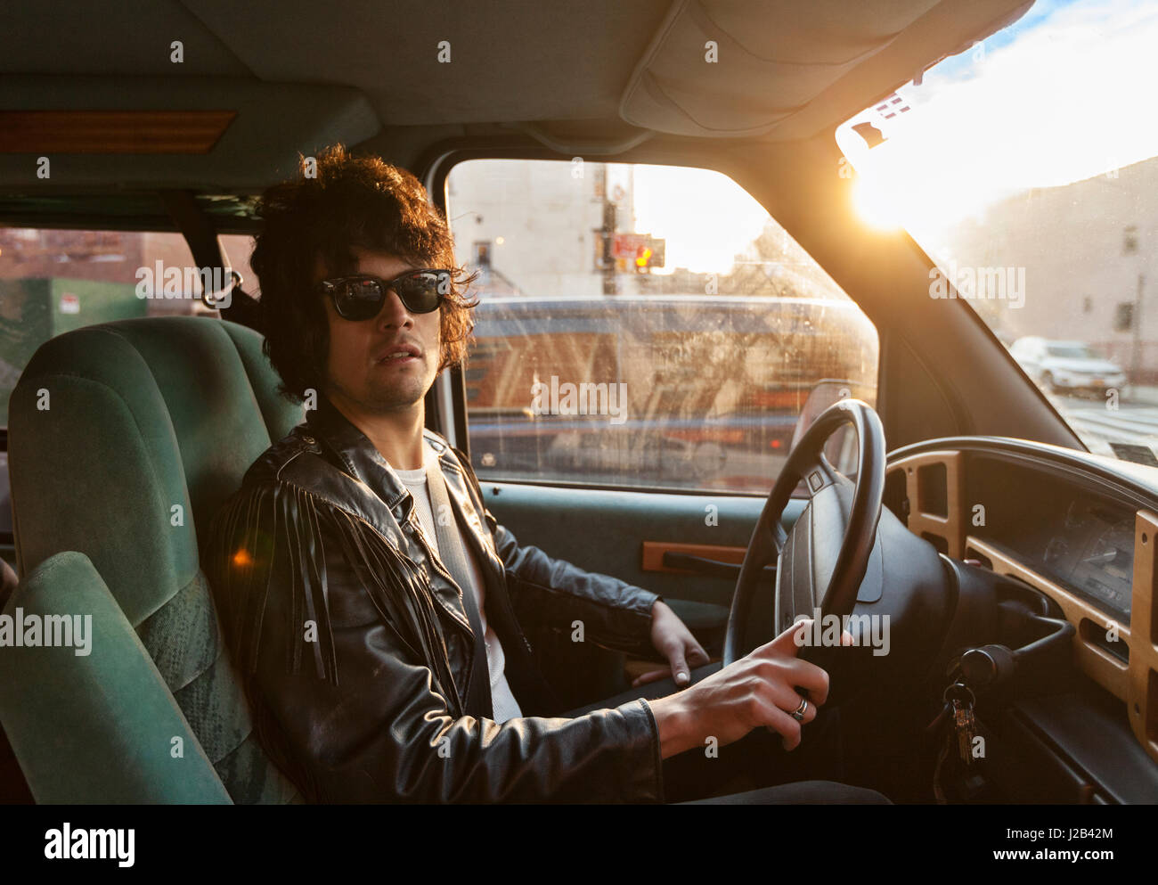 Young man driving Stock Photo - Alamy