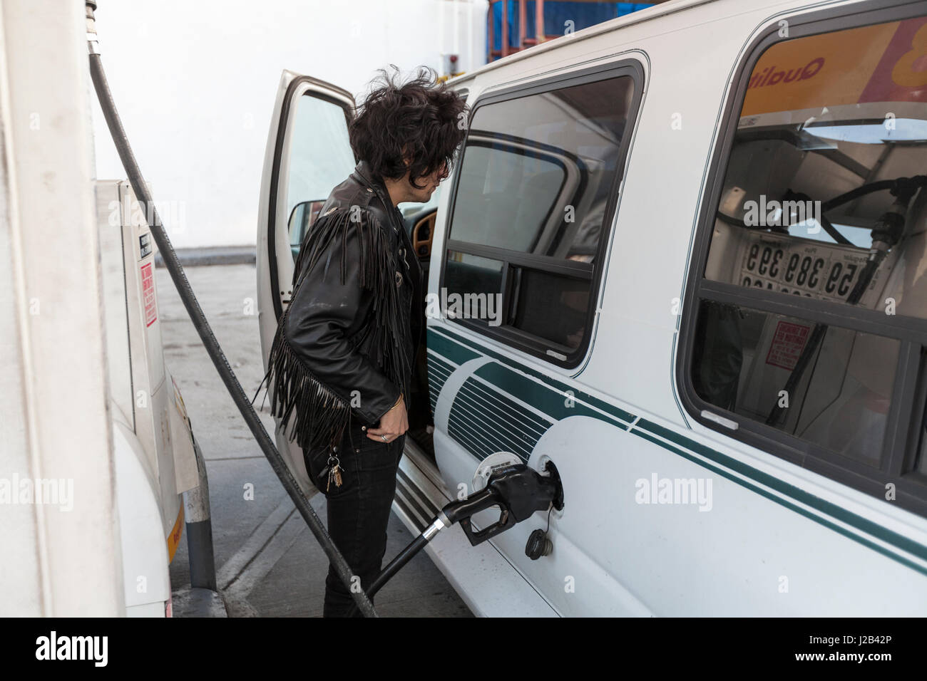 Young man at gas station hi-res stock photography and images - Alamy