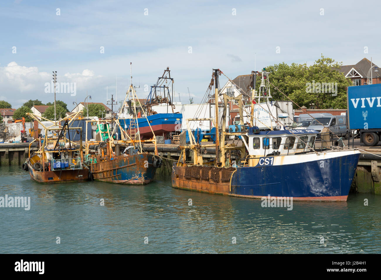 Row of working fishing boats in Camber docks in old Portsmouth. Lots of ...