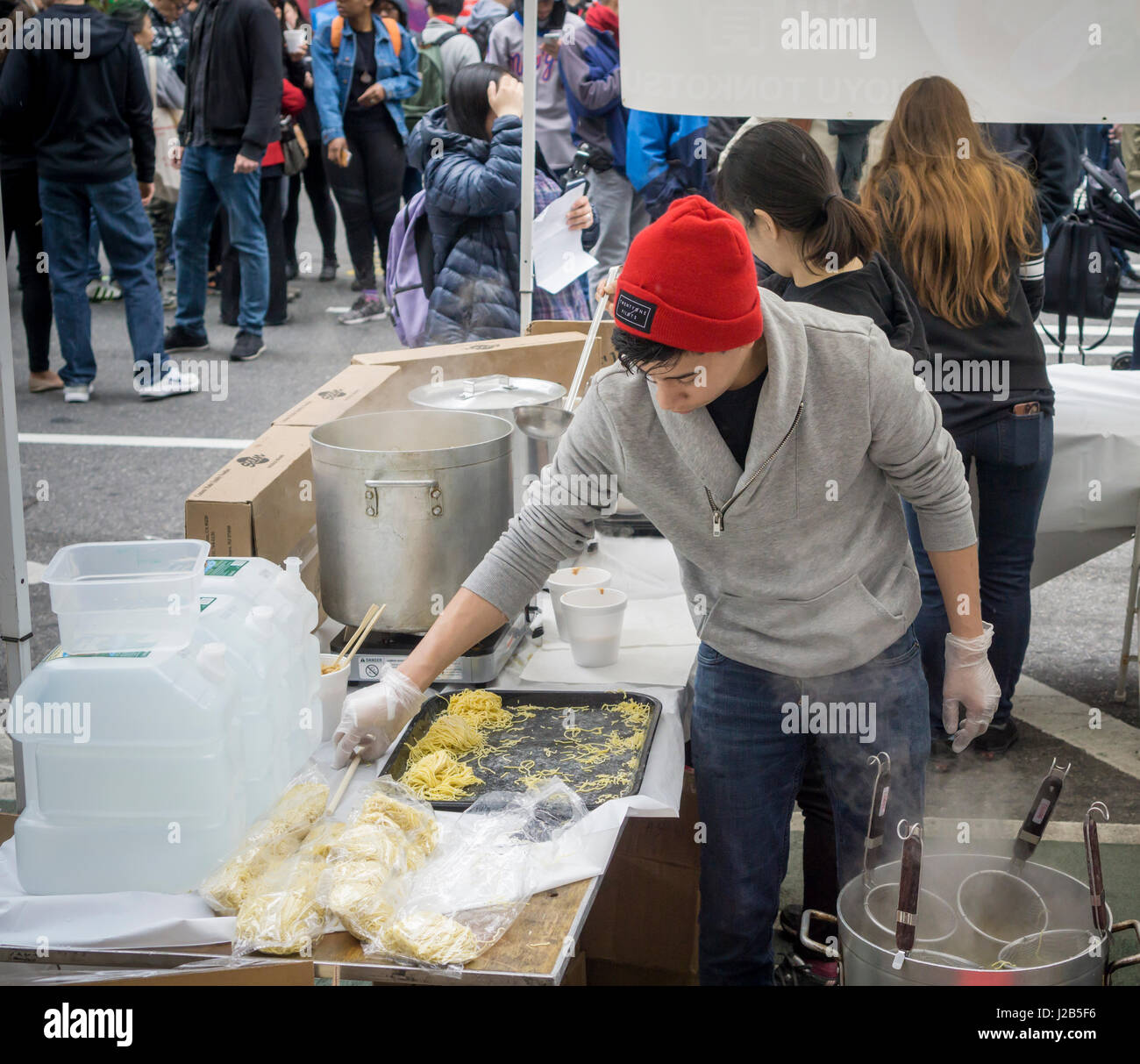 Workers prepare Japanese ramen noodles at a street fair in New York on ...