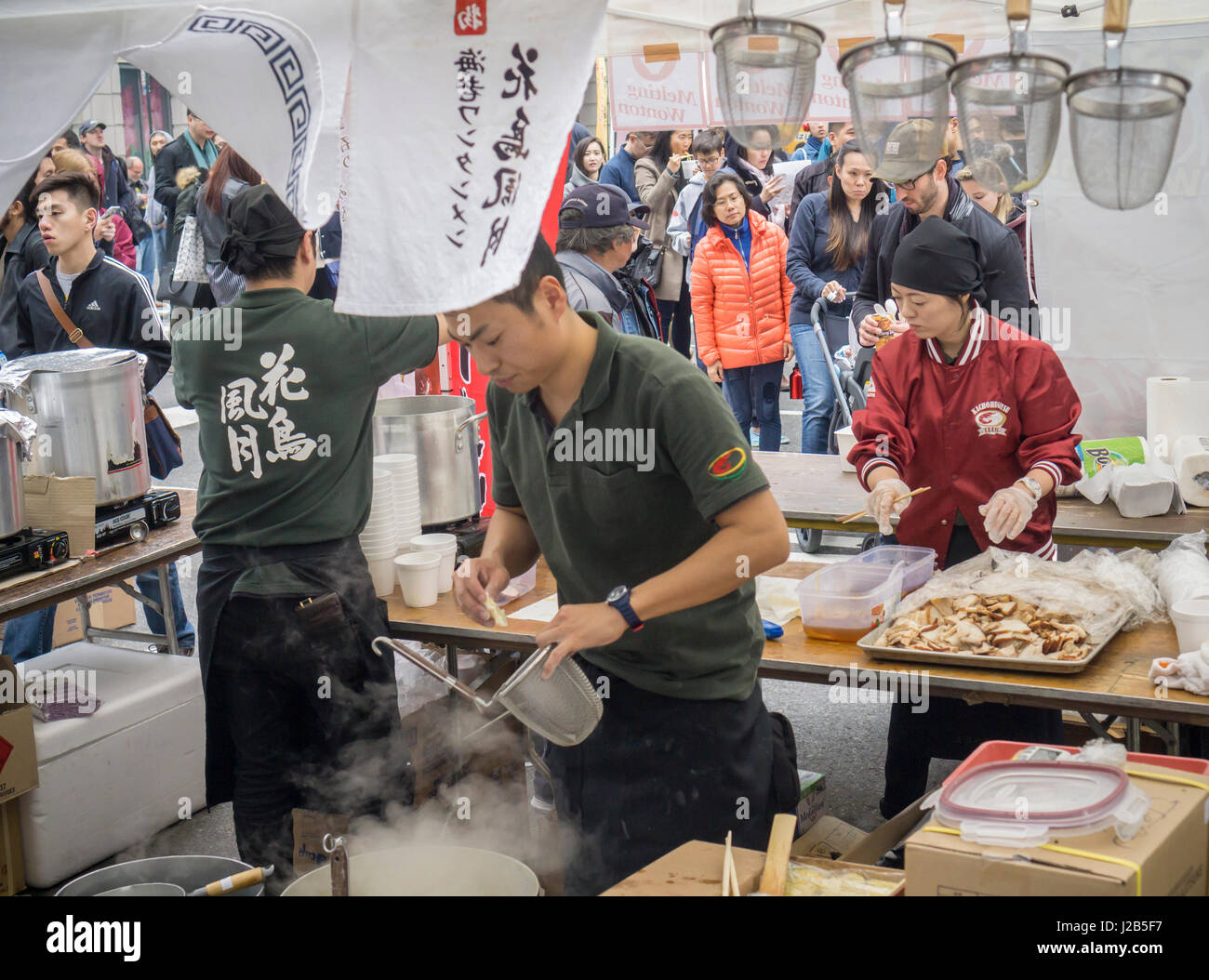 Workers prepare Japanese ramen noodles at a street fair in New York on ...