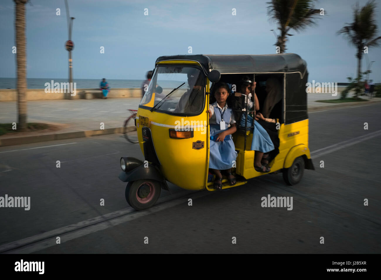 A group of girls return to their homes in rickshaw after leaving school ...