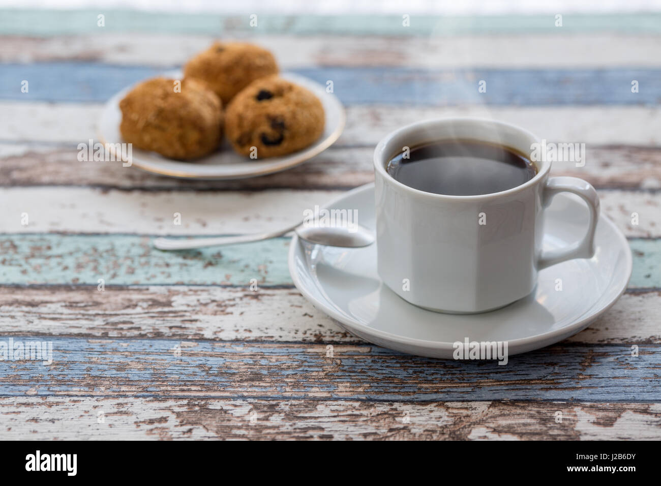 Coffee and pastries on turquoise vintage table Stock Photo - Alamy