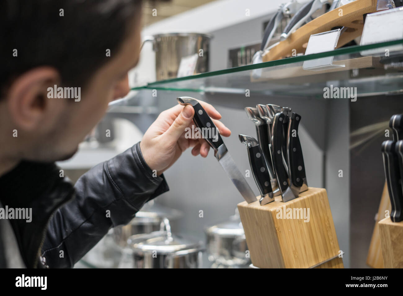 customer's hand choosing set of knives Stock Photo - Alamy