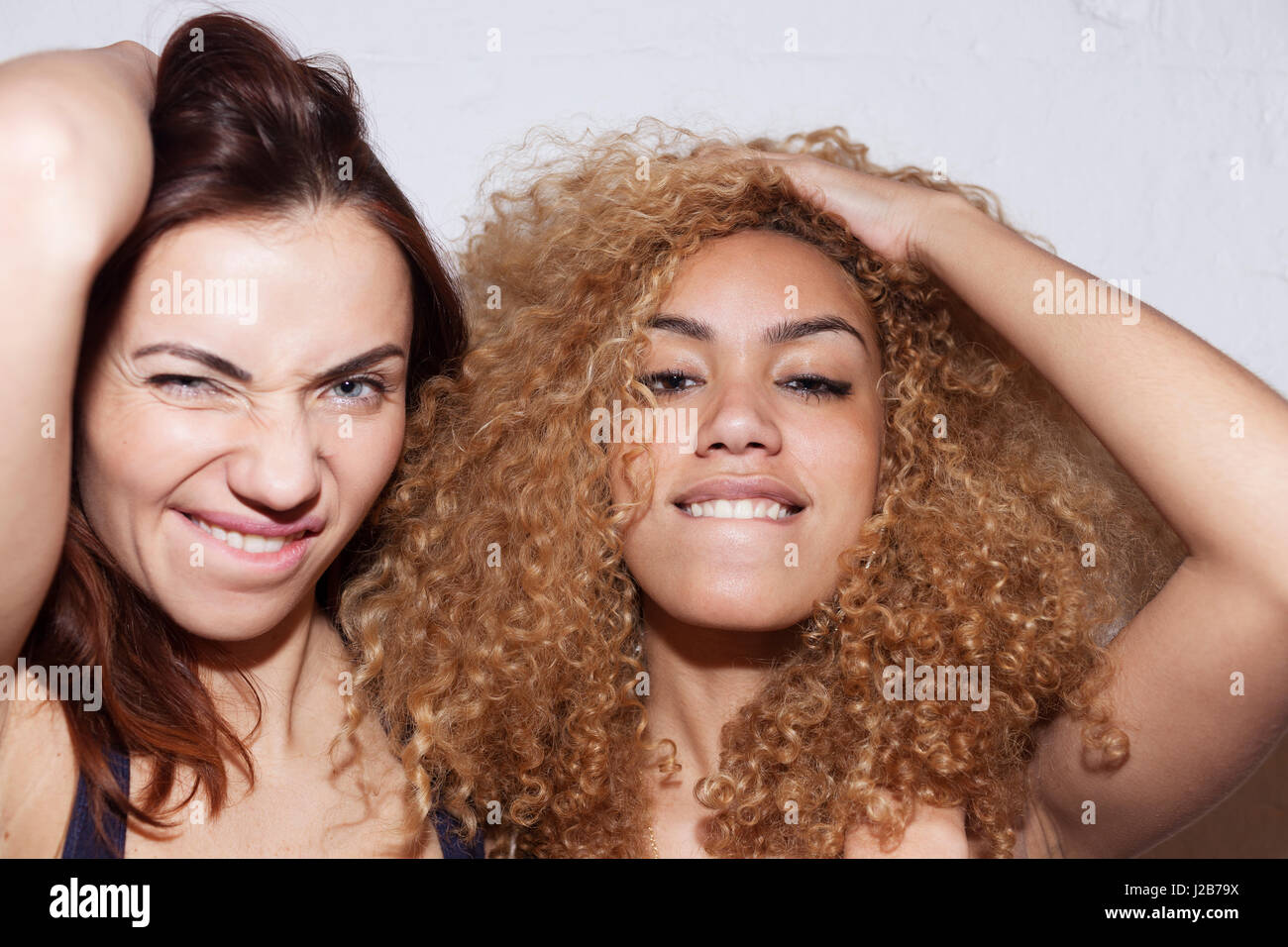 Portrait of two friends posing Stock Photo - Alamy