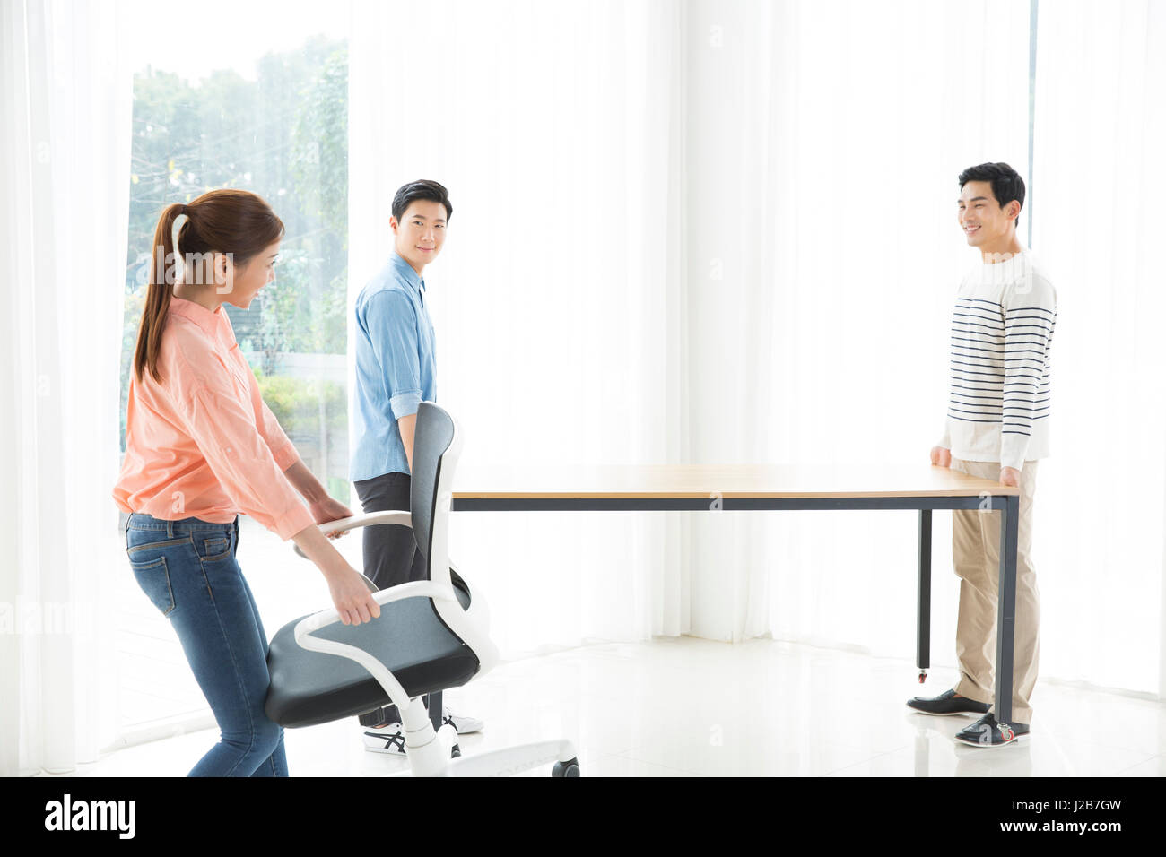 Three people starting business Stock Photo - Alamy