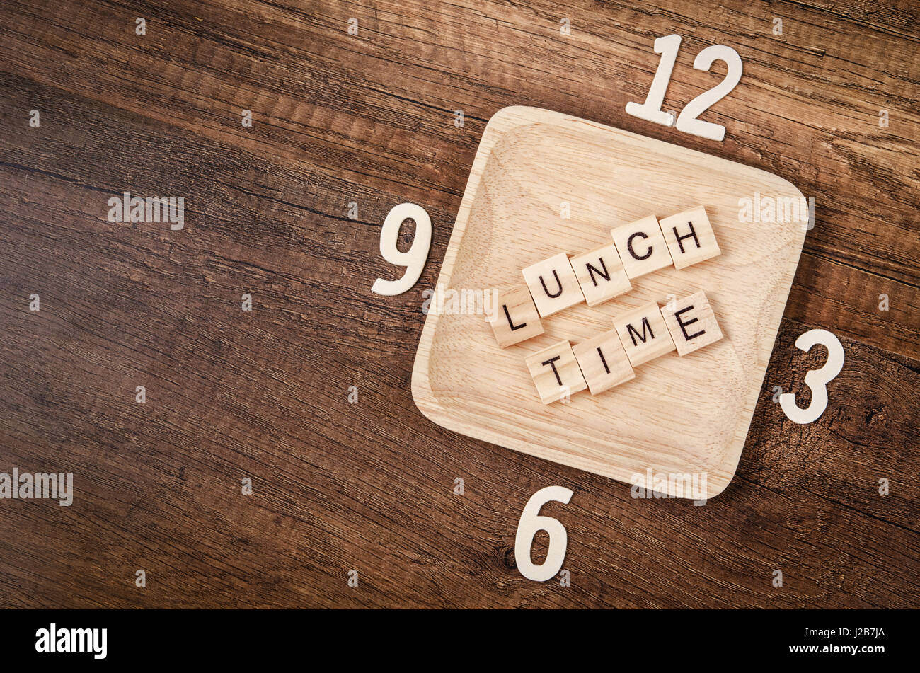 Lunch time wooden alphabet with number of clock. Lunch time concept ...