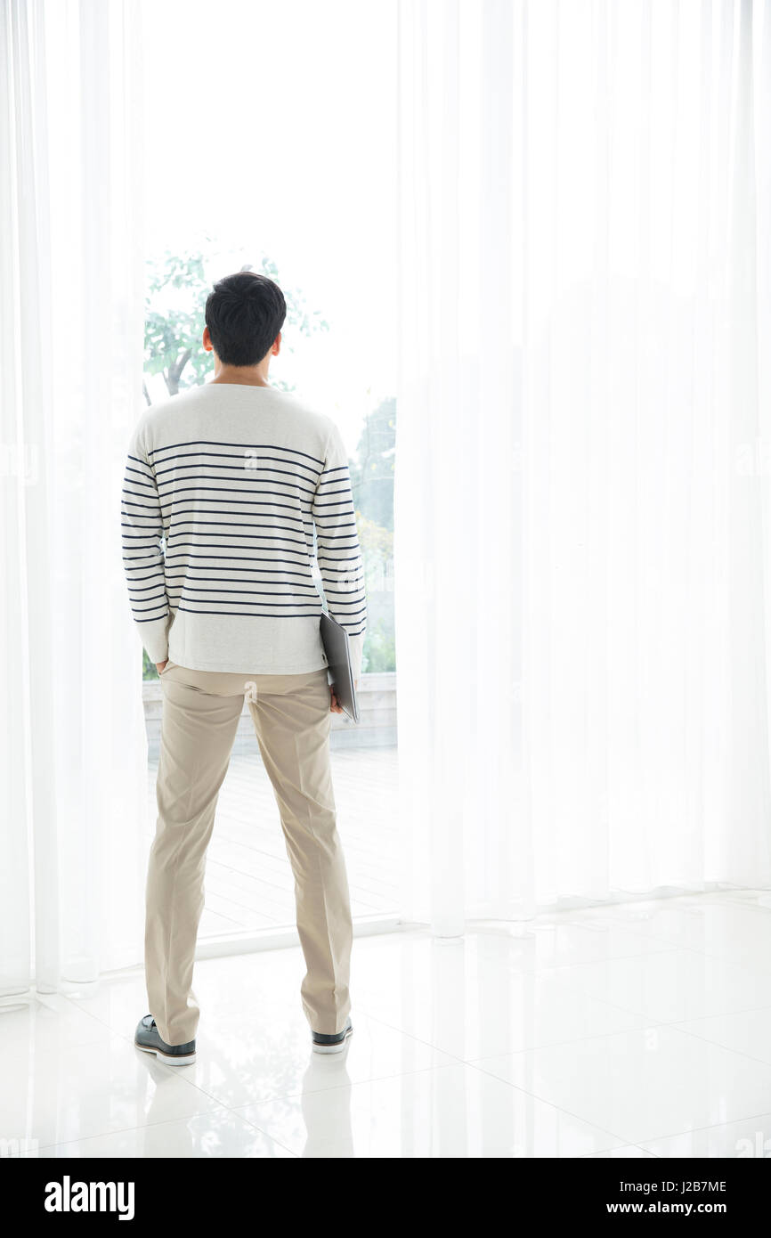 Back of businessman at new office Stock Photo - Alamy