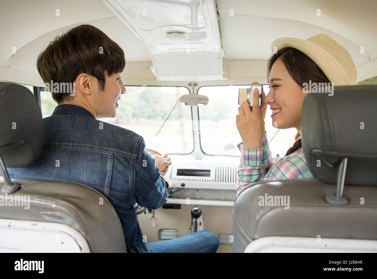 Young smiling people in a car Stock Photo - Alamy