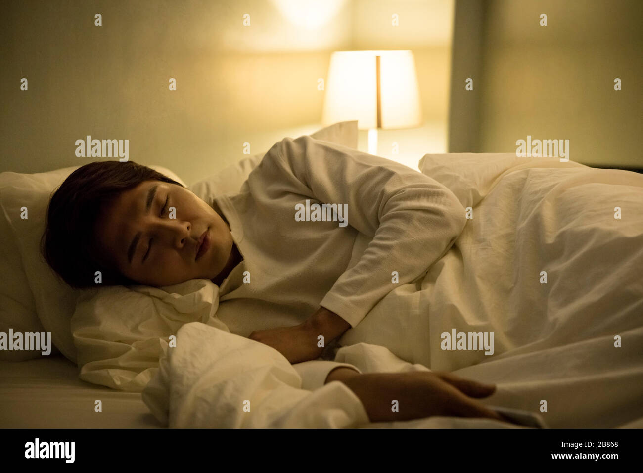 Man sleeping in bed at night hi-res stock photography and images - Alamy