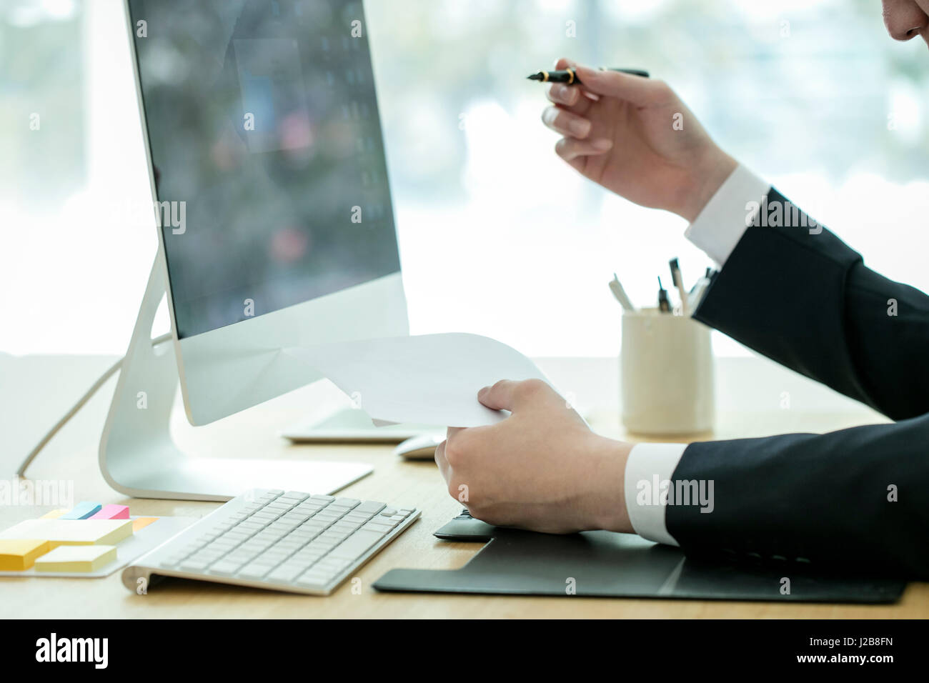 Businessman working with paper and fountain pen Stock Photo - Alamy