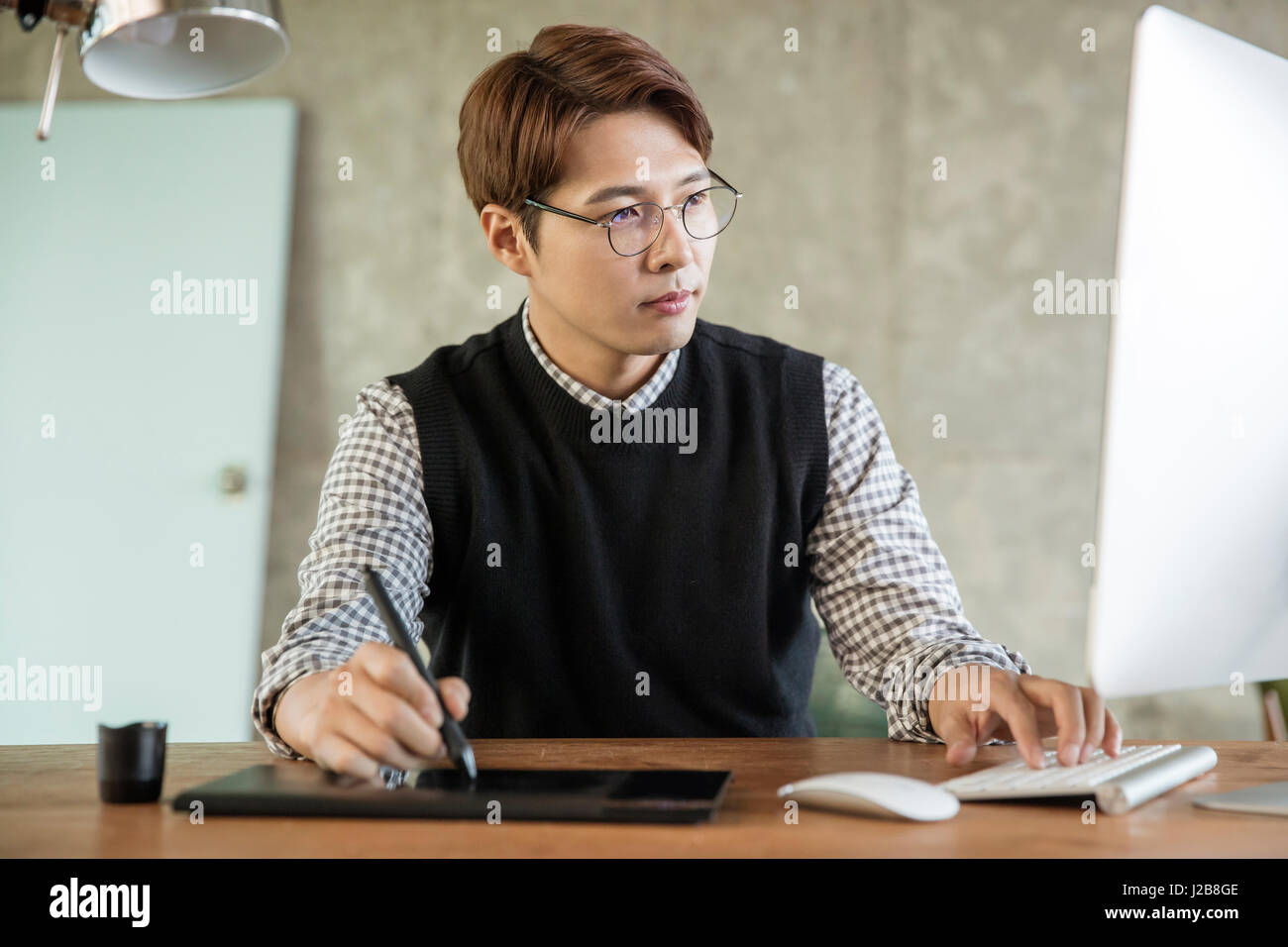 Portrait of cartoonist working Stock Photo - Alamy