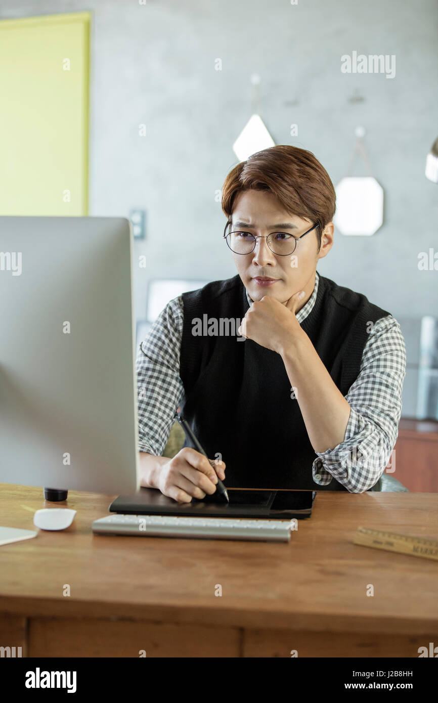 Portrait of cartoonist working Stock Photo - Alamy