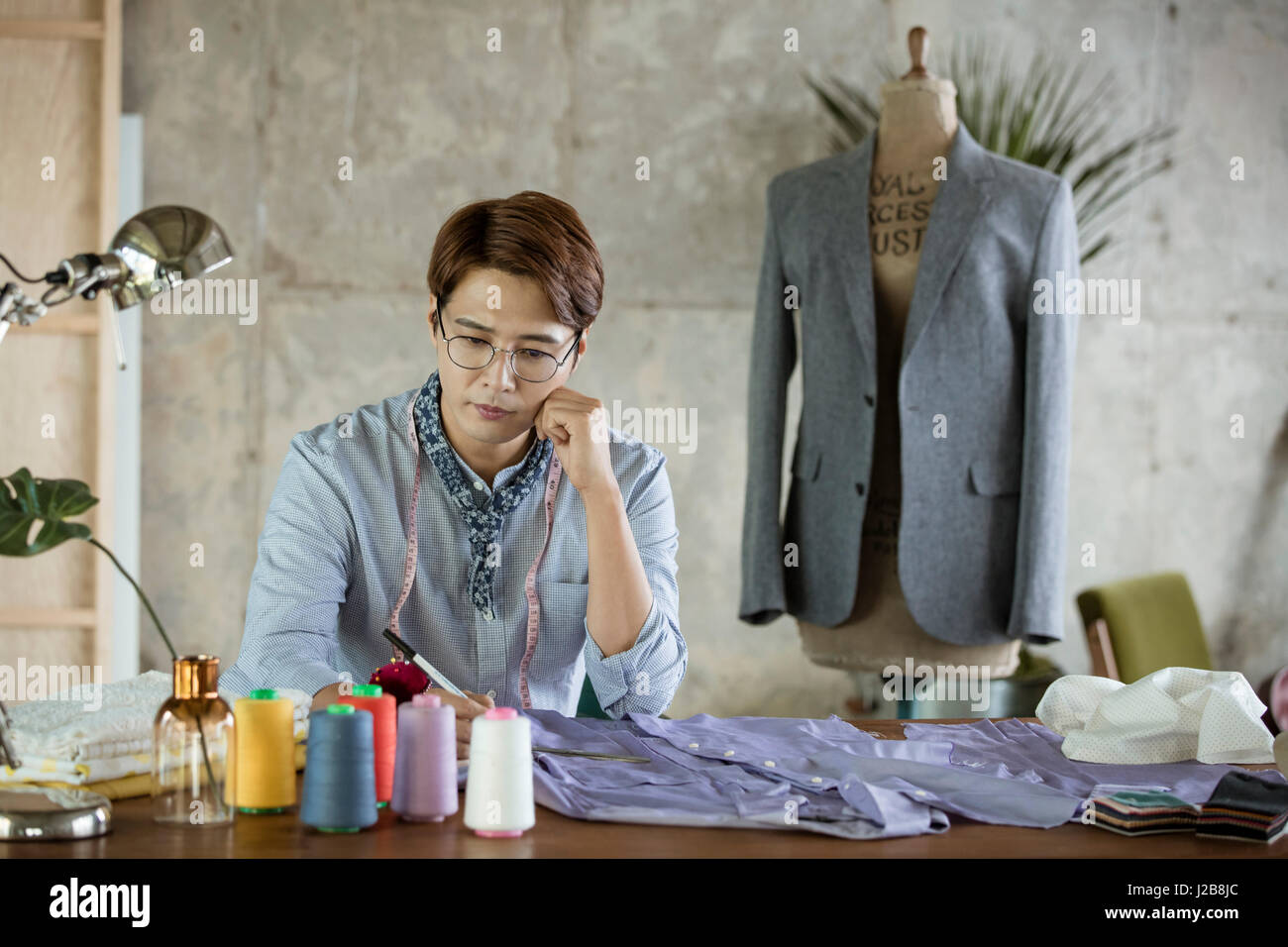 Fashion designer working Stock Photo - Alamy