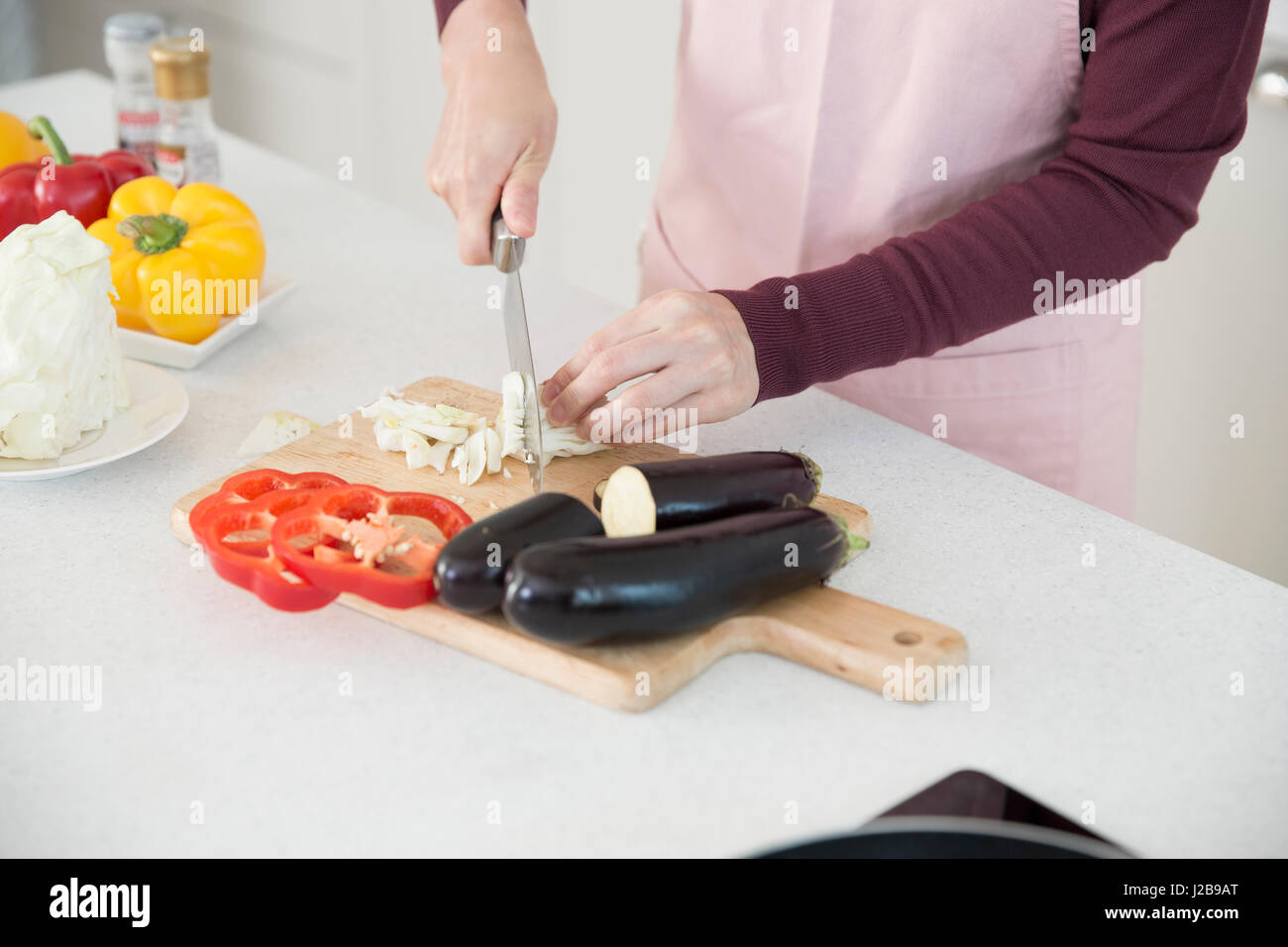 Middle aged woman cooking Stock Photo - Alamy