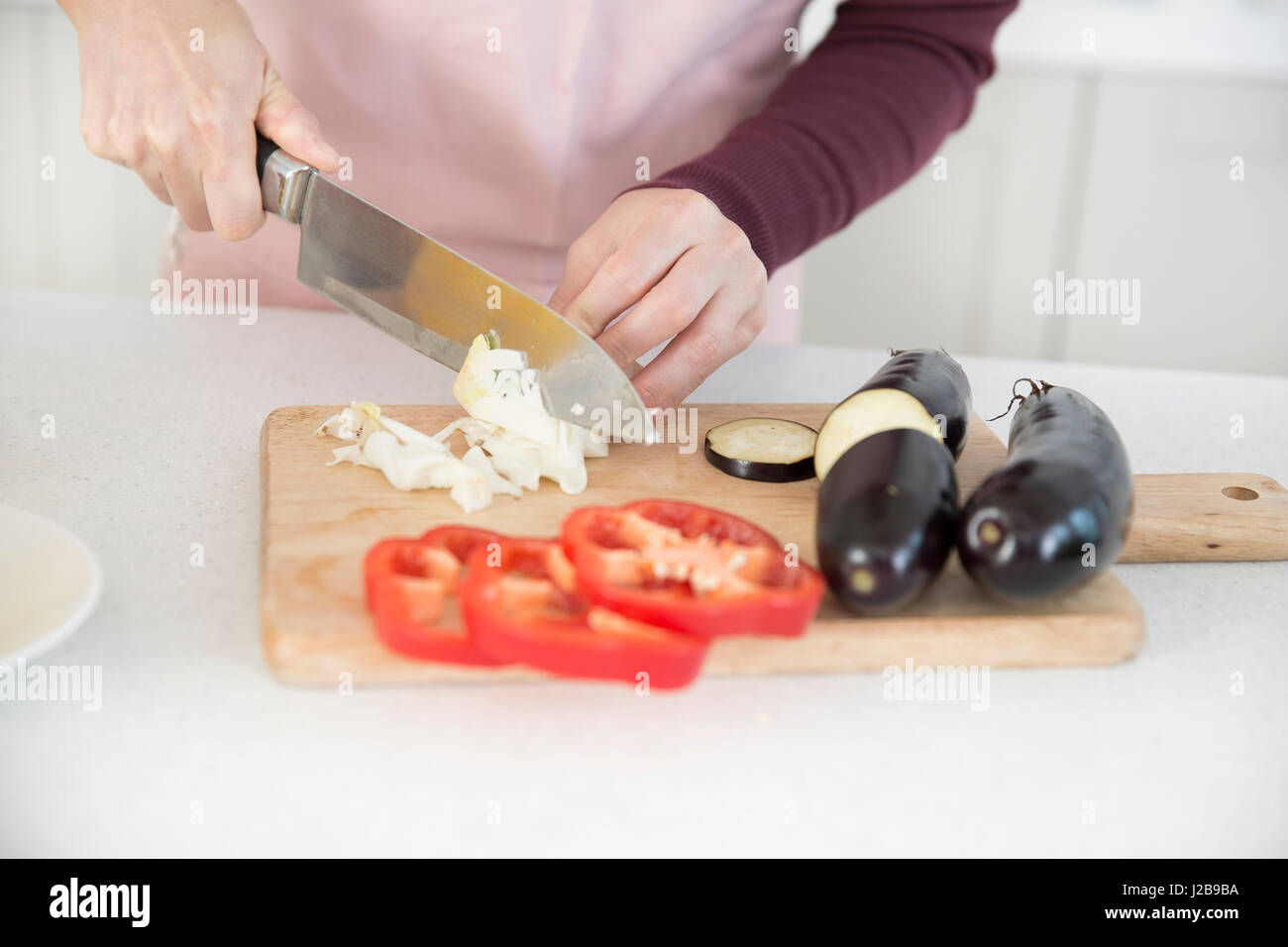 Middle aged woman cooking Stock Photo - Alamy