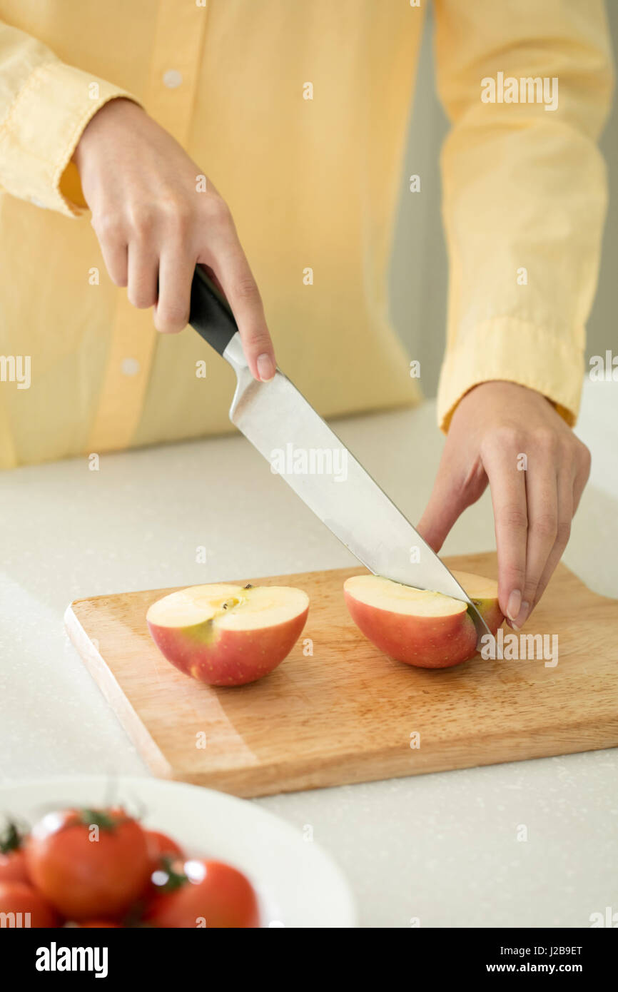 Woman cooking with fruit Stock Photo - Alamy