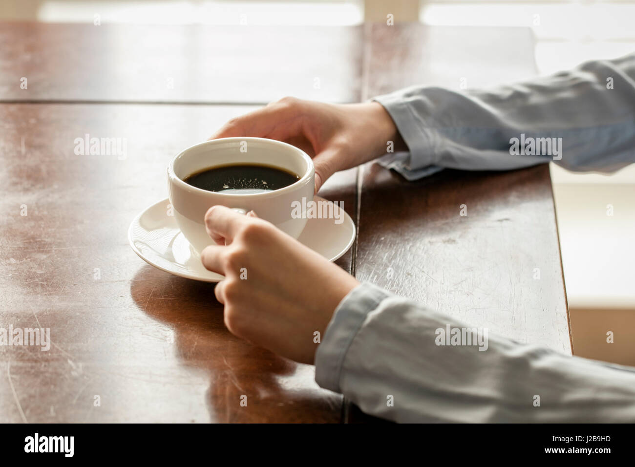 Hands with a cup of coffee Stock Photo - Alamy