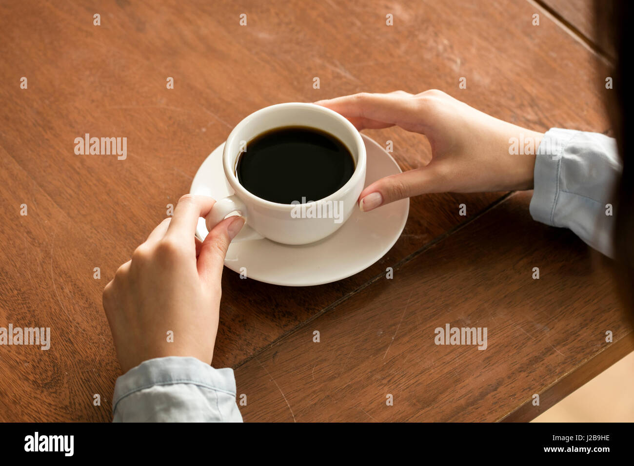 Hands with a cup of coffee Stock Photo - Alamy