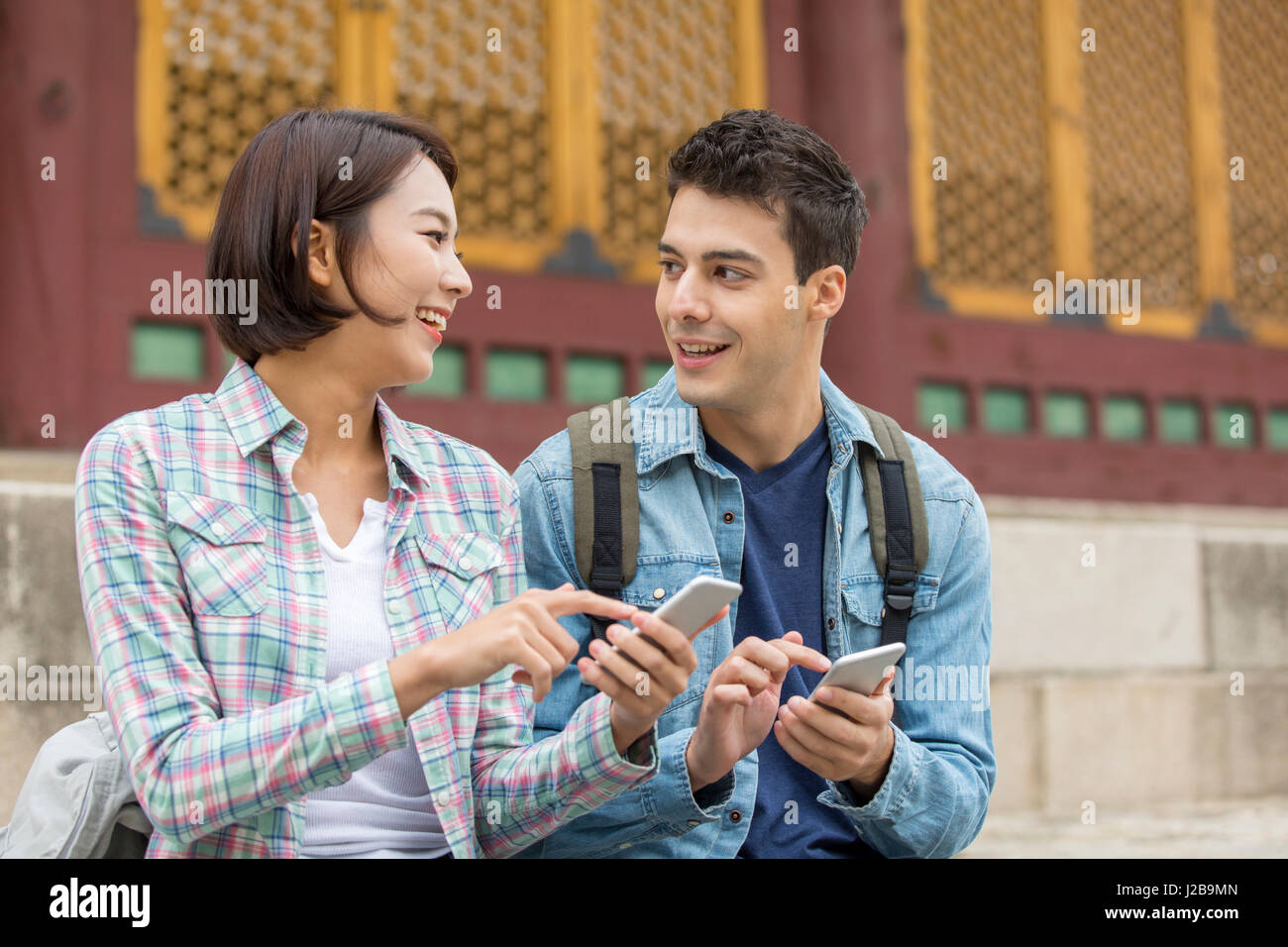 Portrait of young smiling tourists at Korean palace Stock Photo - Alamy