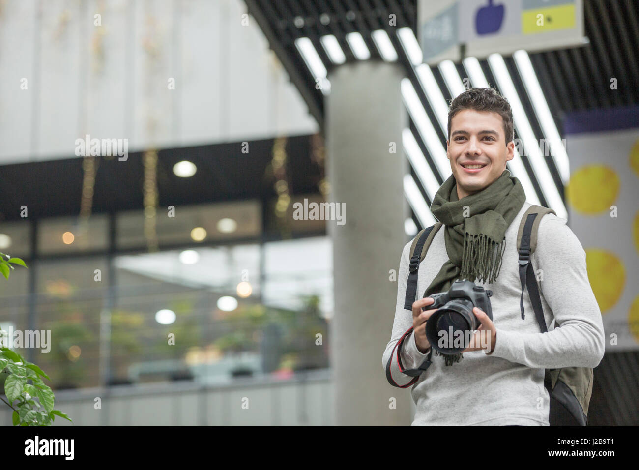Young smiling male tourist Stock Photo - Alamy