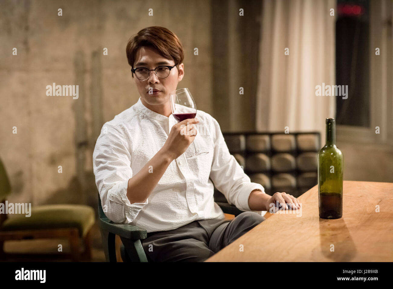 Man drinking wine Stock Photo - Alamy